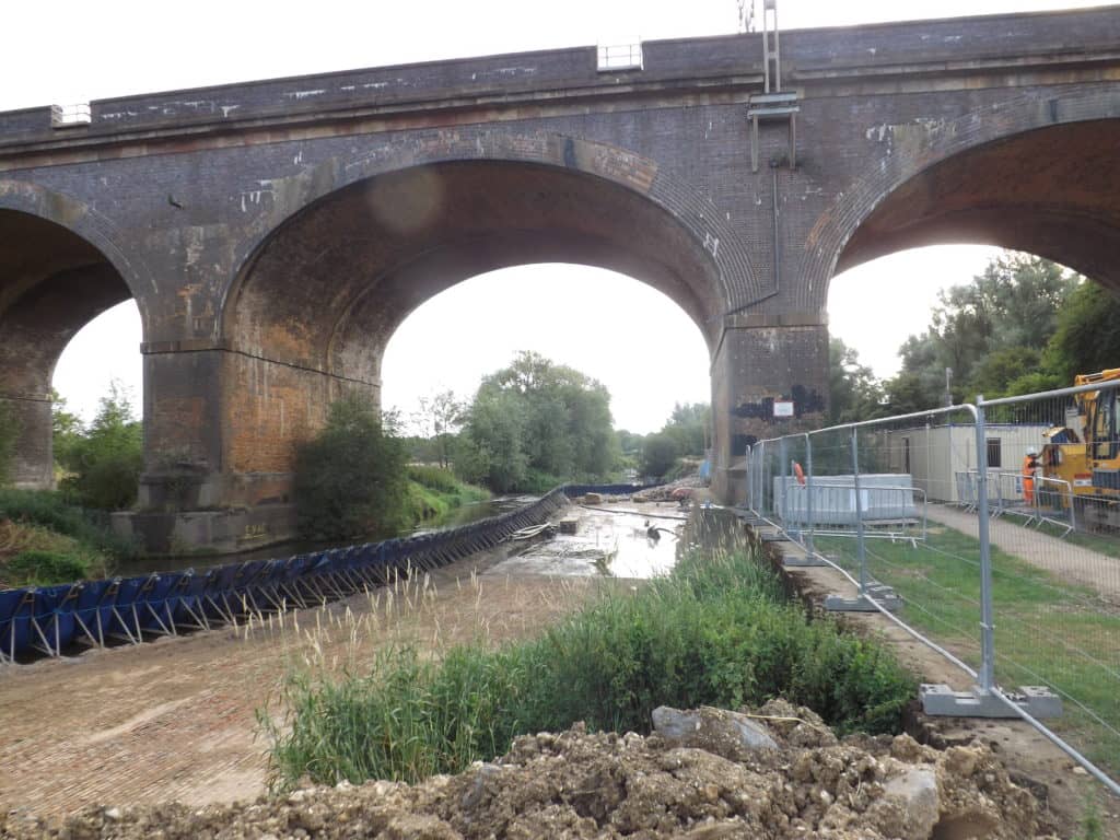 Channel diversion using a portadam temporary dam system - OnSite - OnSite