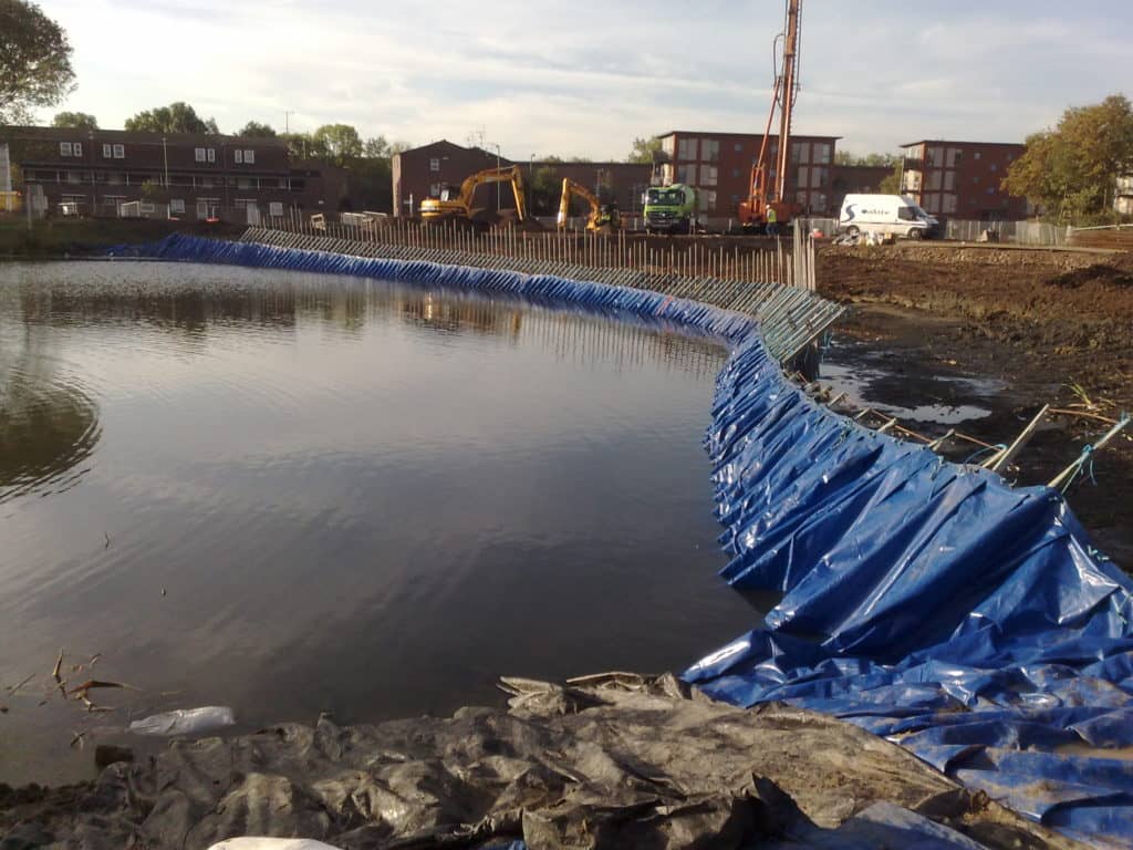 Portadam temporary dam system in a London Lake. - OnSite - OnSite
