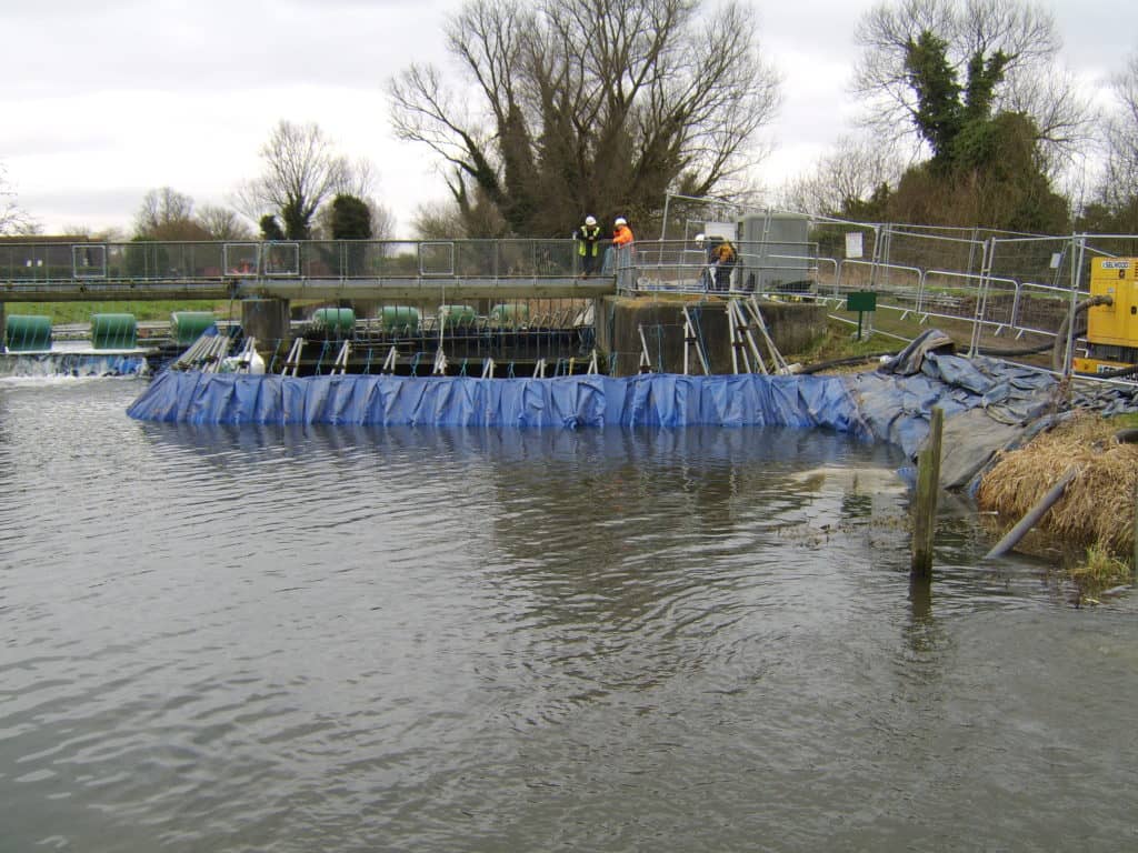 River weir gate repair work using a Portadam temporary dam system ...